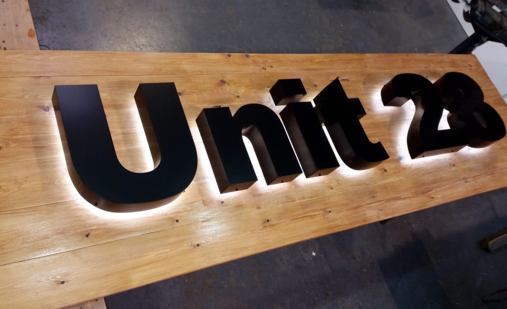 Wooden Panel Sign with Halo Illuminated Built Up Painted Letters ...